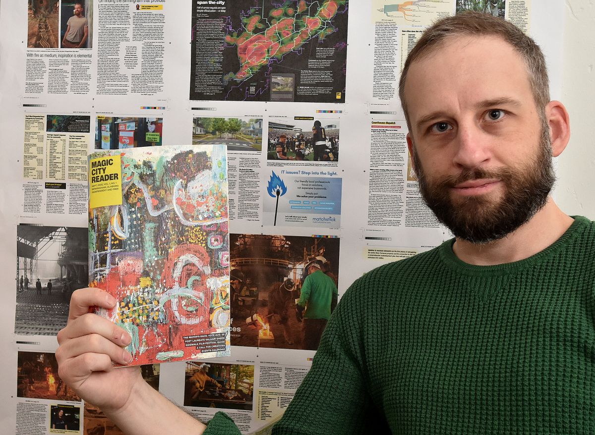 JW Williams holds the first edition of Magic City Reader with the second edition in the ...